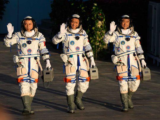 Astronauts Conduct First Spacewalk on China's Space Station | NewsClick